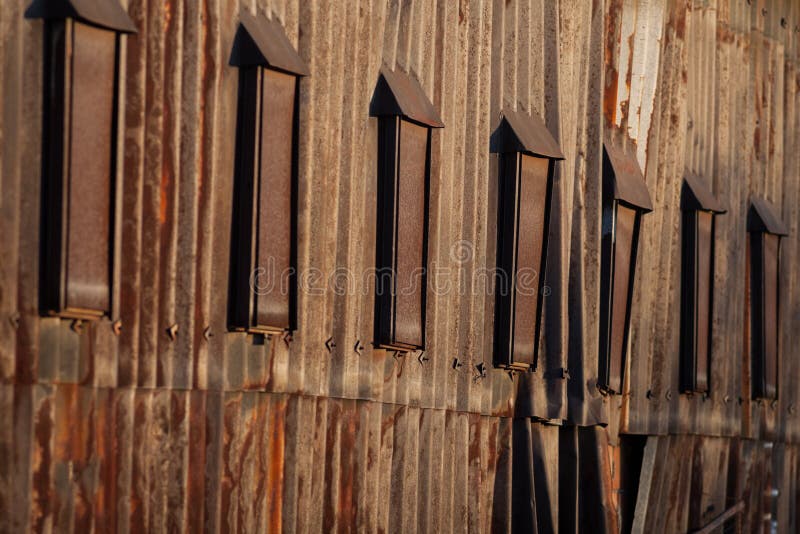 Rusty Metal Facade with Closed Windows Stock Photo - Image of pattern ...