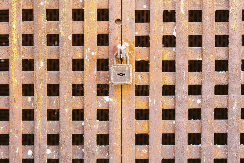 Rusty gate with lock. stock photo. Image of security - 98877172
