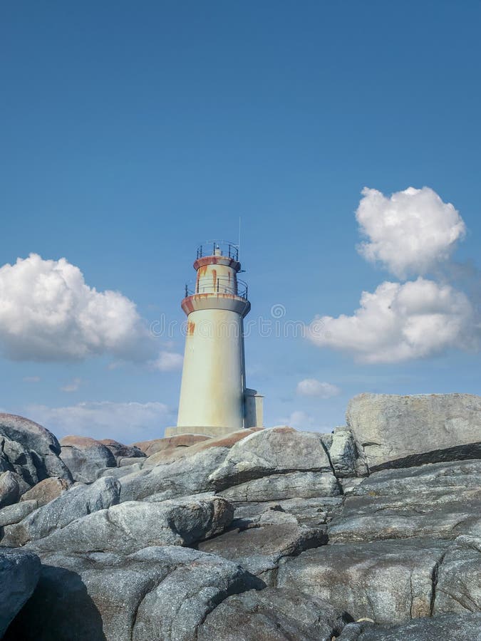 Lighthouse on Rocks stock image. Image of coastline, horizon - 9178605