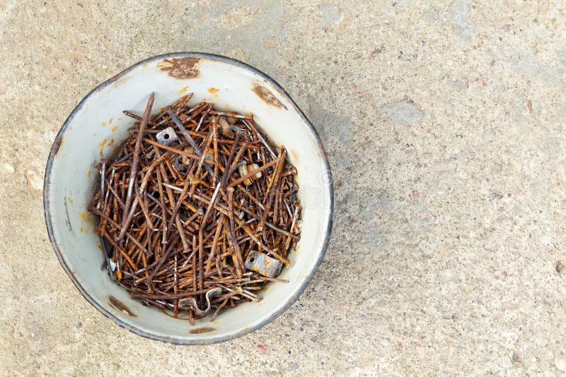 Rusty Metal Nails in a Bowl on the Concrete Surface Stock Image - Image ...