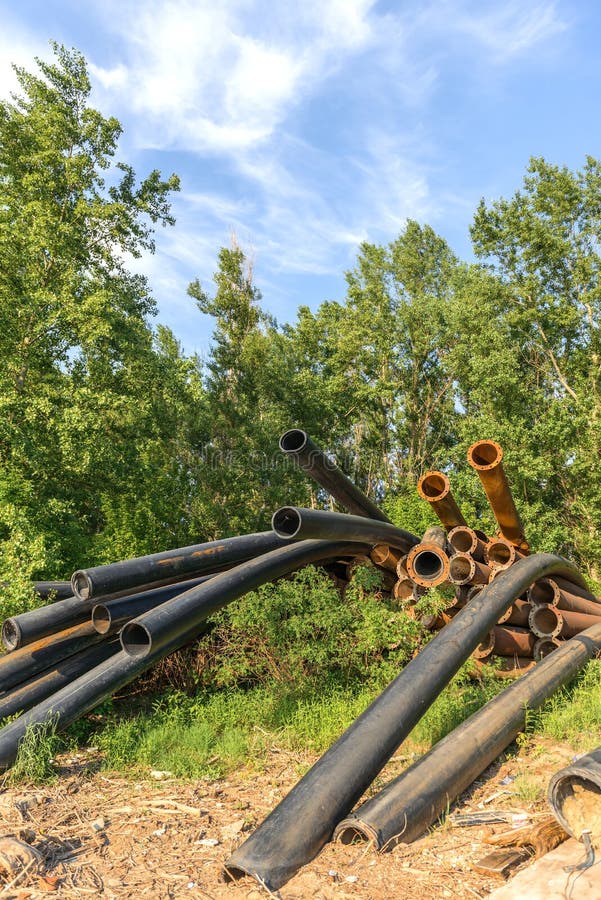 Rusty Metal Pipes in the Forest Stock Photo - Image of pipe, corrosion ...