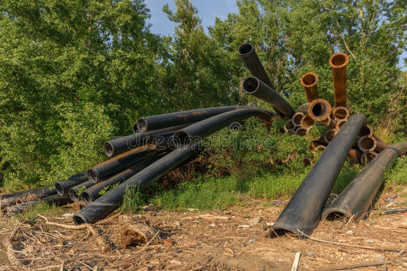 Rusty Metal Pipes in the Forest Stock Photo - Image of large, pipe ...