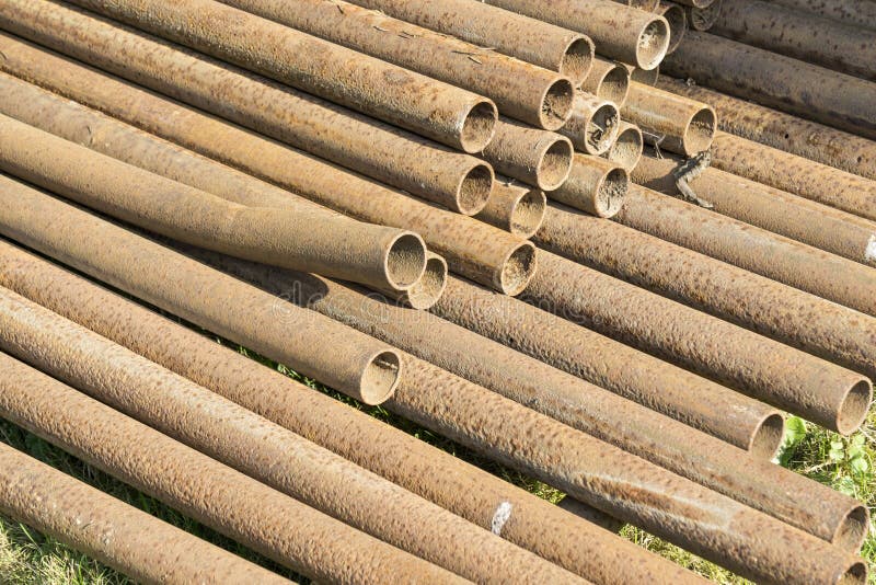 Rusty metal pipes stack stock photo. Image of piled, rust - 79006046