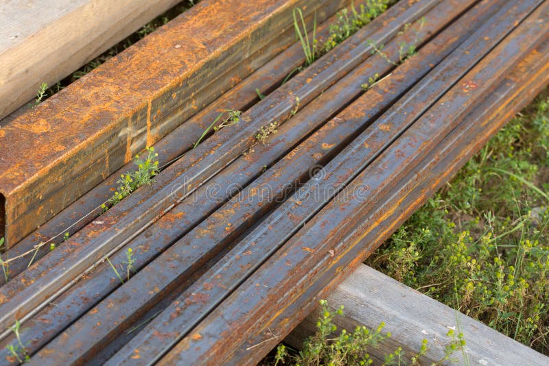 Rusty Metal Profile on the Grass Stock Photo - Image of corrosion ...