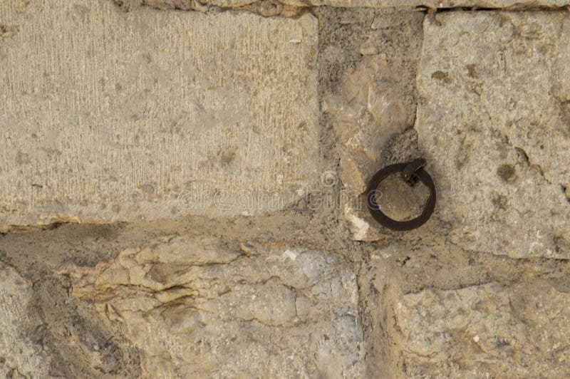 One Rusty Metal Ring Anchored To a Stone Wall Stock Photo - Image of ...
