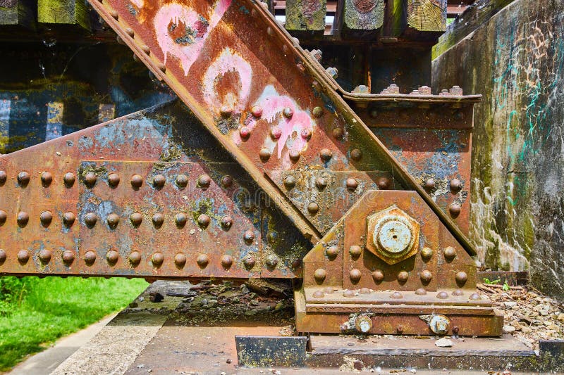 Rusty Metal Rivets on Railroad Bridge Side View and Pink Graffiti with ...