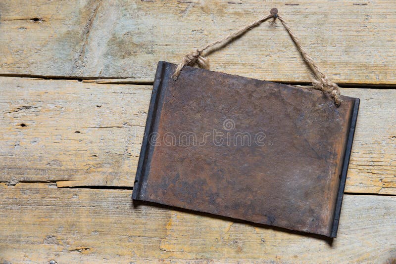 Rusty Metal Sign on Wooden Table Stock Image - Image of rust, wooden ...