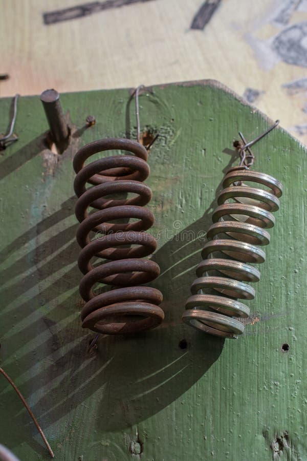 Rusty Metal Spring on the Wooden Surface Stock Photo - Image of brown ...