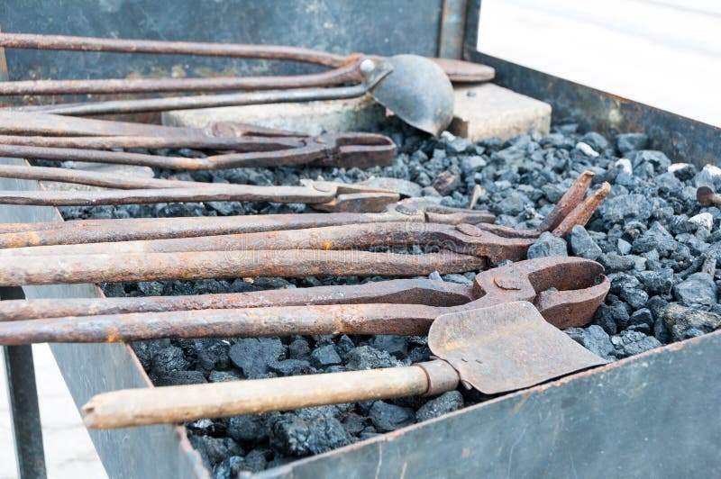 Rusty metal tools at forge stock photo. Image of hammer - 50341874