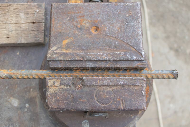 Rusty Metal Vise Holding Ribbed Steel Rebar in Workshop Setting Stock ...