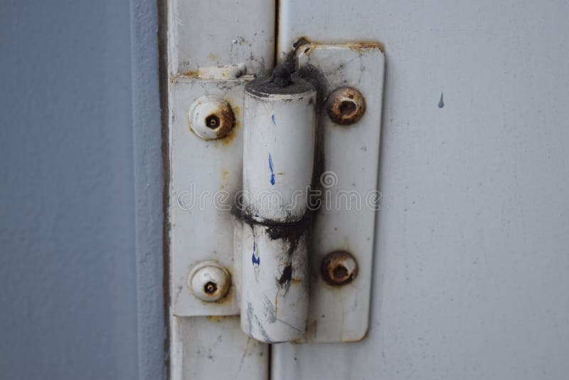 Rusty metallic door hinge stock photo. Image of blue - 82375140