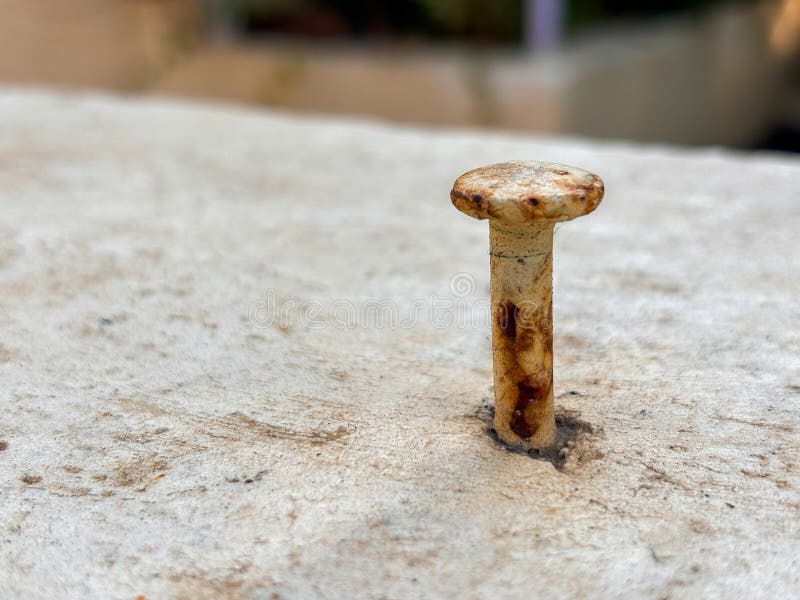 A Rusty Nail is Sitting on a White Surface Stock Image - Image of ...