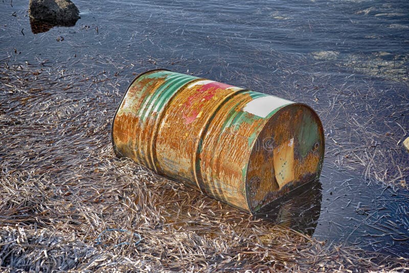 Rusty Oil Barrel Near the Shore of the Sea Stock Image - Image of ...