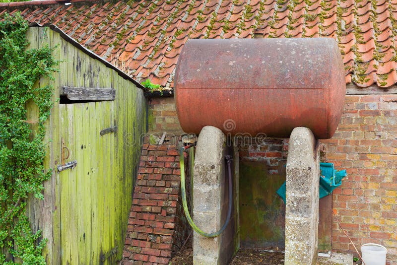 Rusty Oil Tank on Concrete Supports Stock Image - Image of roof, metal ...