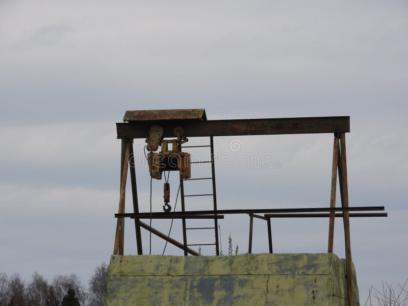 Rusty Old Buildings, a Crane and a Pole Repair Work at Russia Stock ...