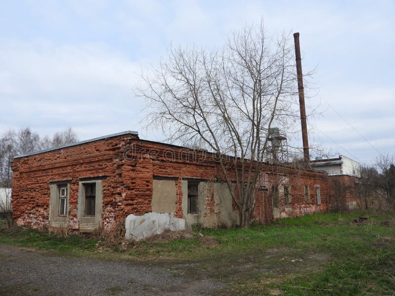 Rusty Old Buildings, a Crane and a Pole Repair Work at Russia Stock ...