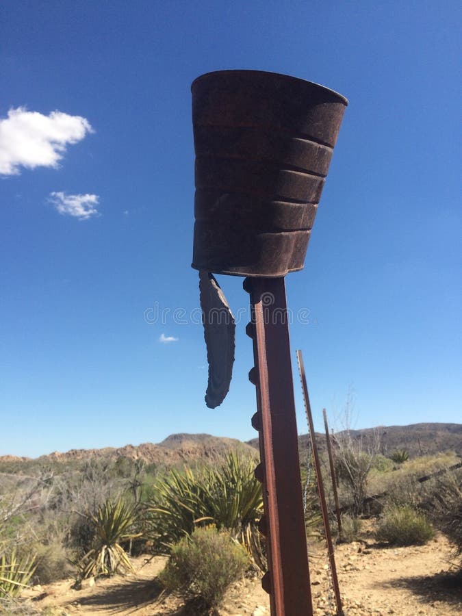 Rusty Old Can Upside Down on Post in Desert Stock Photo - Image of ...