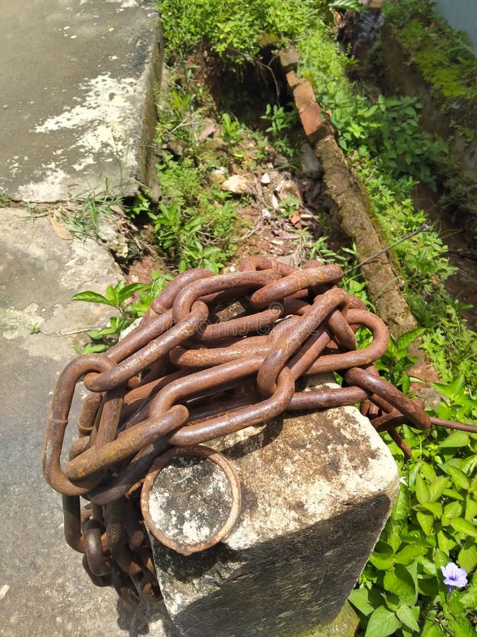 Rusty Old Chain in the Road Edge Stock Photo - Image of edge, rusty ...