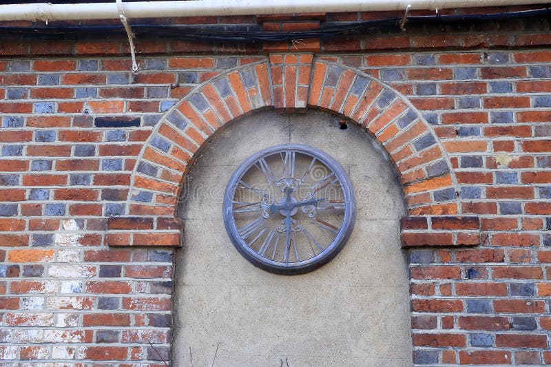 Rusty Old Clock Face Under a Brick Arch Stock Image - Image of hands ...