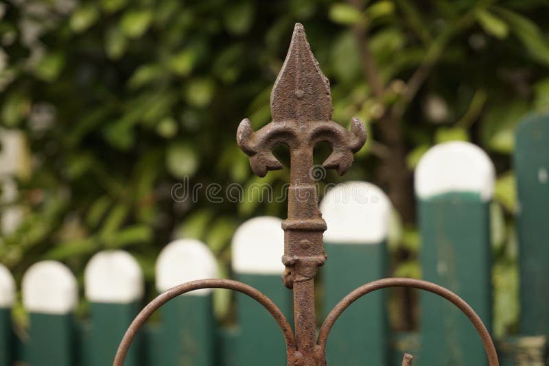 Rusty Old Fence Spike in Garden Stock Photo - Image of fence, garden ...