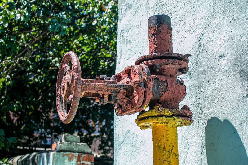 Rusty Old Gas Tap on the Background of the Wall of the House Stock ...