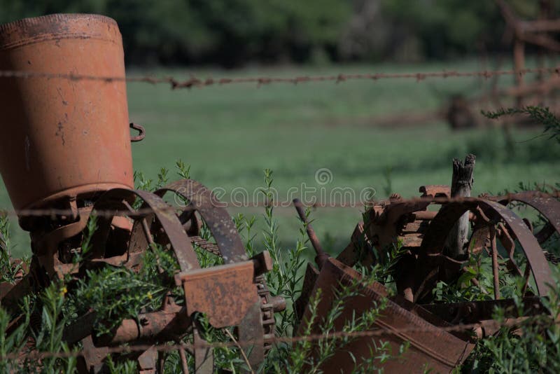Old Rusted Equipment that are Near the Ground with Grass Stock Image ...