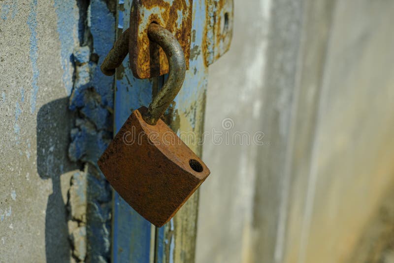 A Rusty Old Padlock Securing a Steel Gate Stock Photo - Image of unlock ...