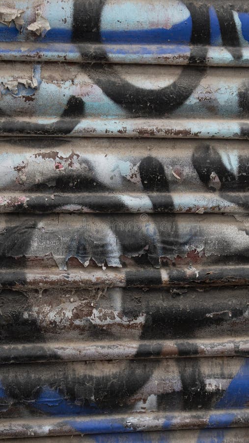 Rusty Old Shutter with Graffiti Stock Photo - Image of street, fence ...