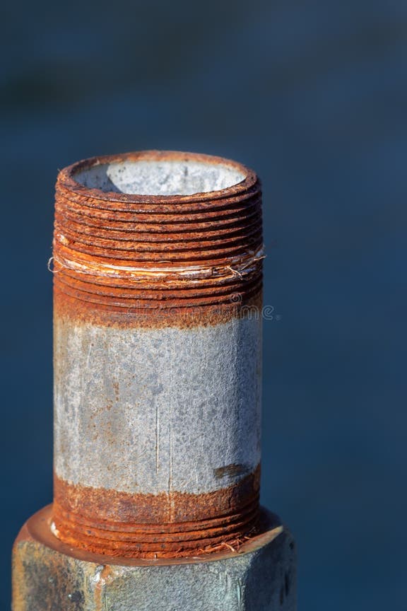 Rusty Old Pipe Sticking Out the Side of a Board Walk Stock Photo ...