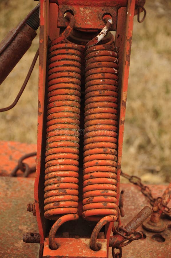 Rusty Orange Machinery Springs with Blurred Natural Backdrop ...