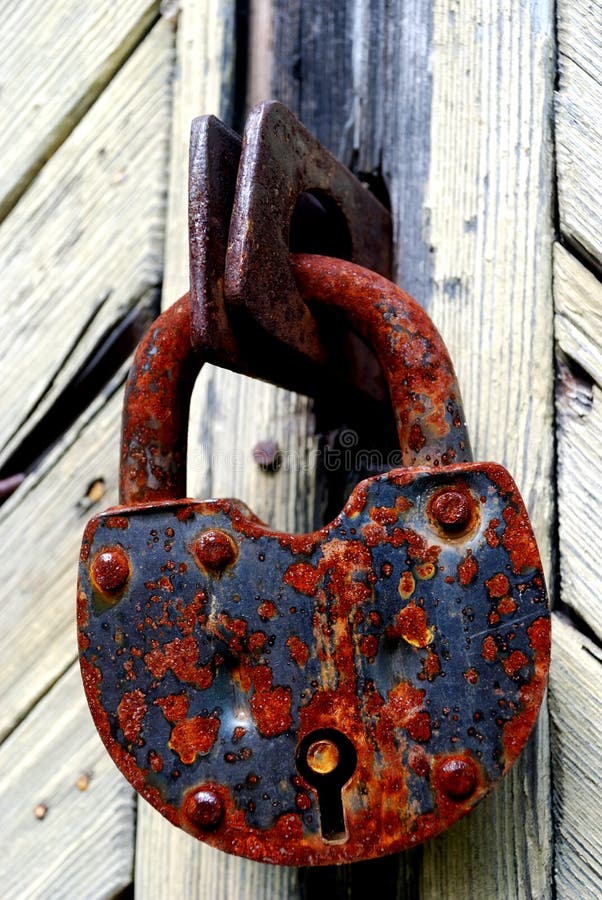 Old Rusty Padlock and Latch on a Wooden Door Stock Image - Image of ...
