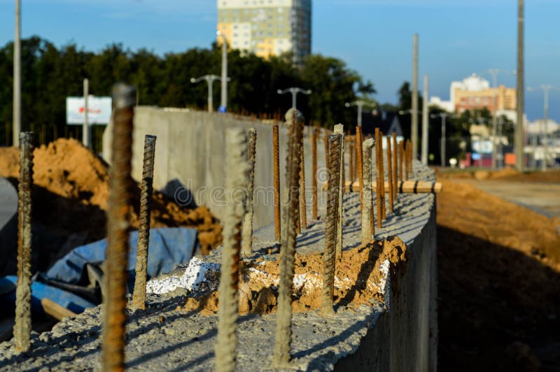 Rusty Pins Sticking Out of Concrete Blocks. Laying of Blocks for the ...