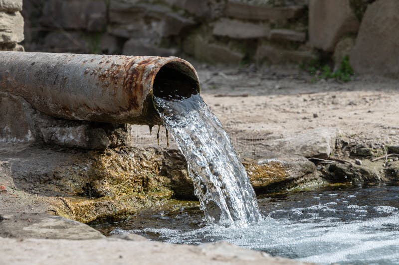 Rusty Pipe with Flowing Water into the River. Stock Image - Image of ...