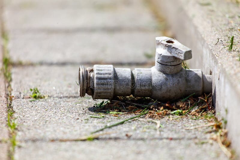 A Rusty Pipe is Laying on the Ground Stock Photo - Image of valve ...