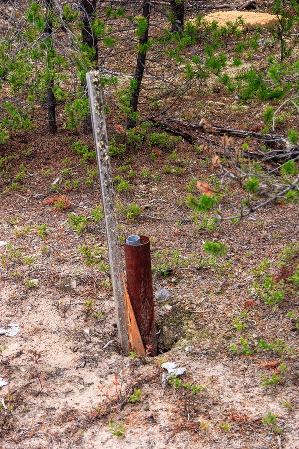 A Rusty Pipe Sticking Out of the Ground in a Field Stock Image - Image ...