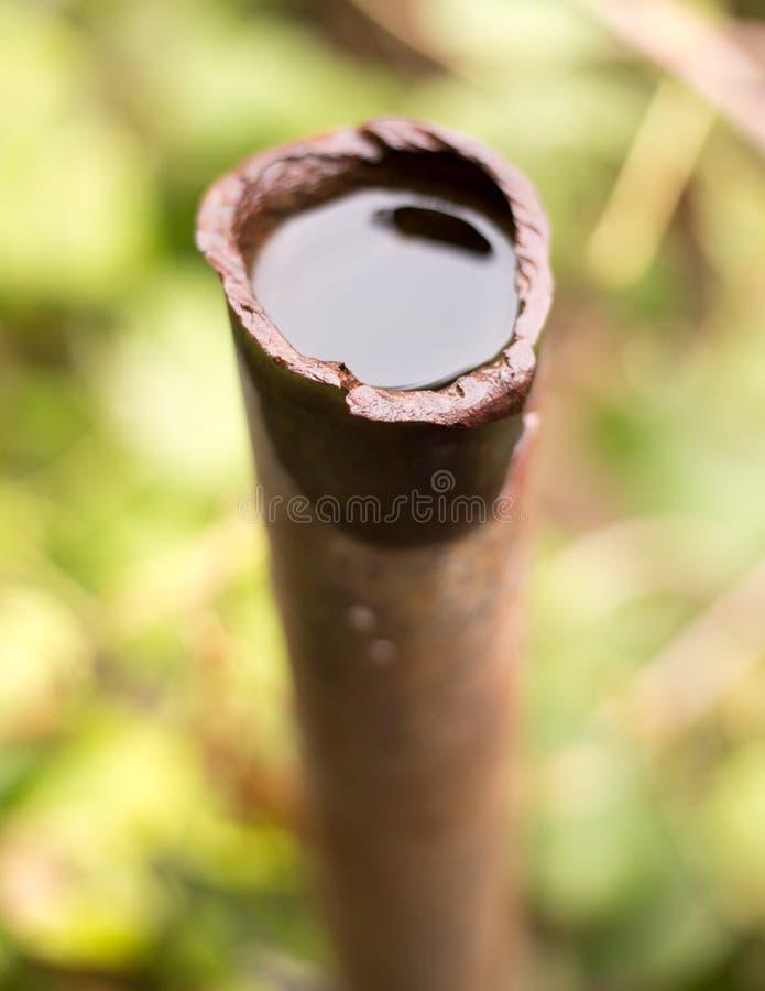 Rusty Pipe with Water in Nature Stock Image - Image of garbage, tube ...