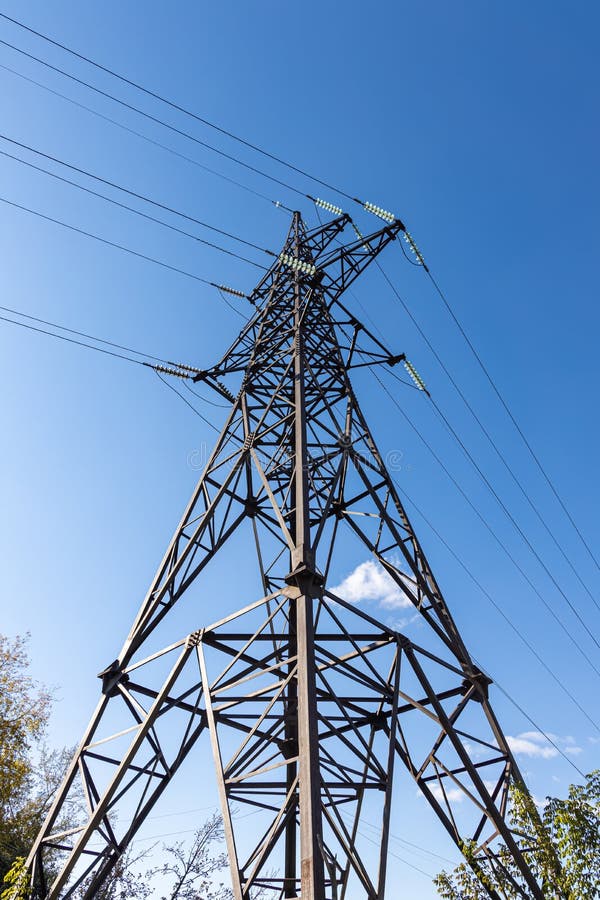 Rusty Power Line is on the Blue Sky Background. Vertical Stock Image ...
