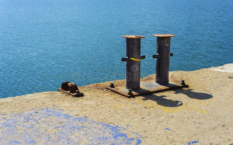 Rusty pylons in harbor stock image. Image of metallic - 40561729