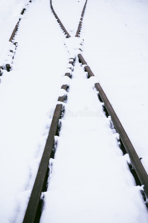 Railroad tracks in snow. stock image. Image of confusion - 99502247
