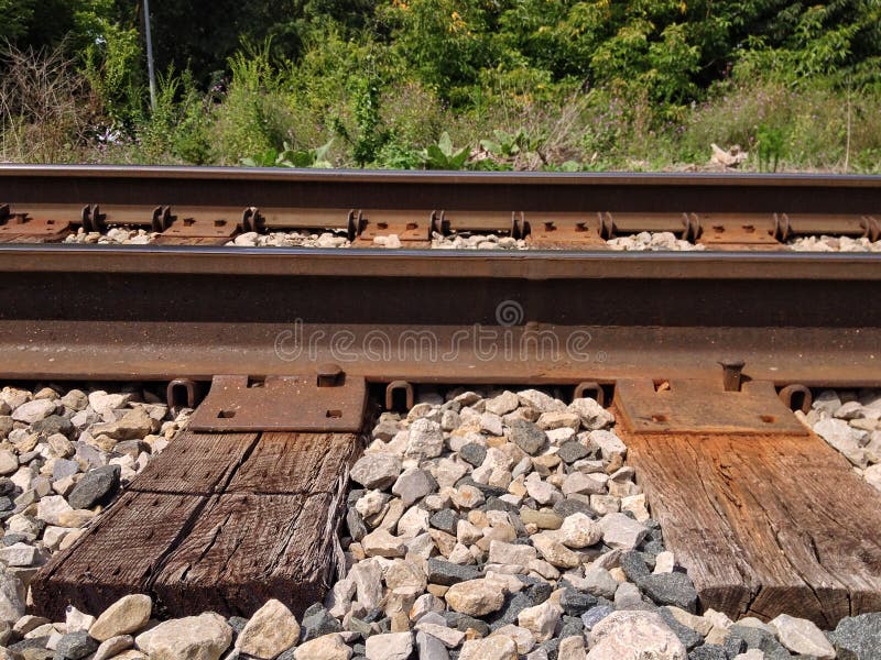 Rusty Railroad Tracks through Town Stock Image - Image of rust, ballast ...