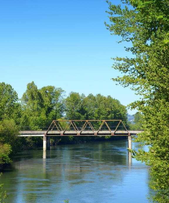 Rusty Railroad Trestle Over a River Stock Photo - Image of train ...