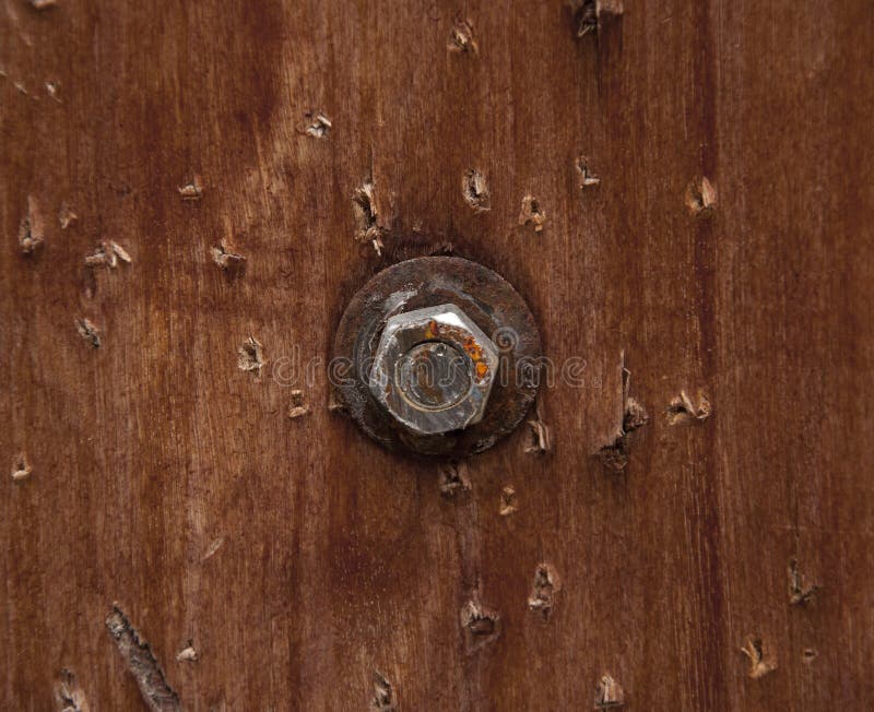 Rusty Red Bolt and Nut on a Wooden Wall Stock Photo - Image of ...