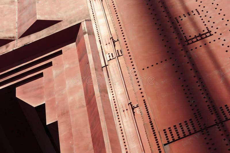 Rusty Red Industrial Structure with Geometric Patterns and Shadows ...