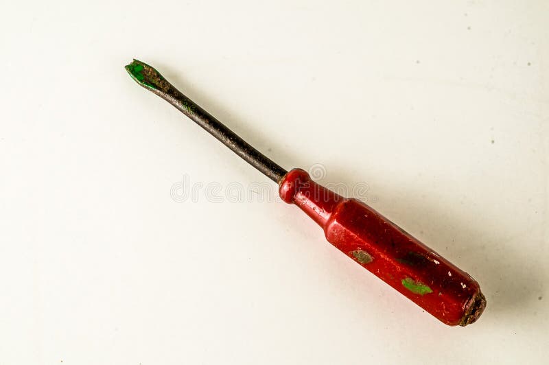 A Rusty Red Screwdriver with a Green Handle Stock Photo - Image of ...
