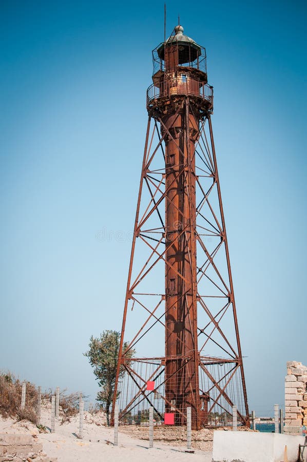 Rusty Relic: an Abandoned Lighthouse Reaching for the Sky Stock Photo ...