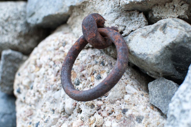 Rusty ring on stone wall stock photo. Image of ring, rusty - 86639814