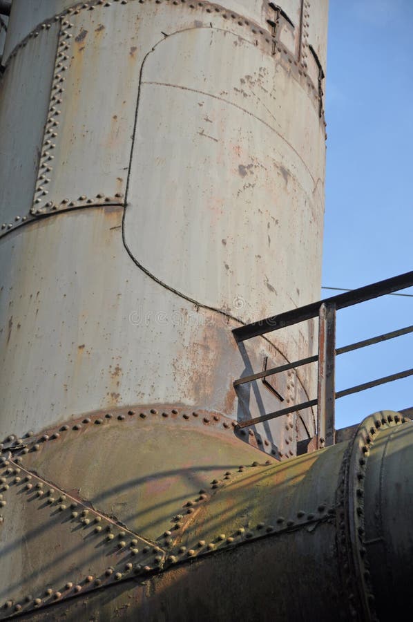 Rusty riveted steel plates stock image. Image of railing - 74658313