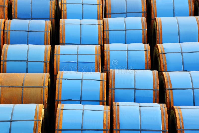 Rusty rolled metal in port stock photo. Image of piled - 101072500