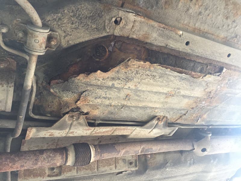 Rusty and Rotten Bottom of the Car. a Rusted Off Piece of Car Bottom ...