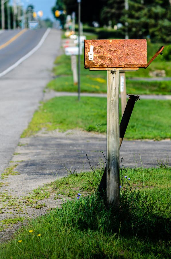 Rusty Rural Mailbox in Front of a Mail Box Row Stock Photo - Image of ...